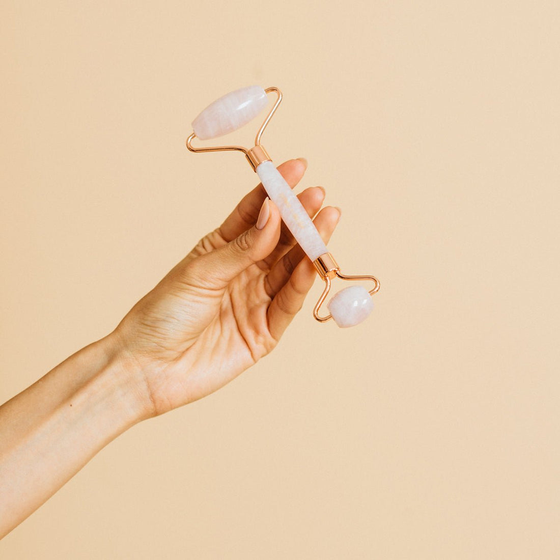 rose quartz face roller by grace & stella